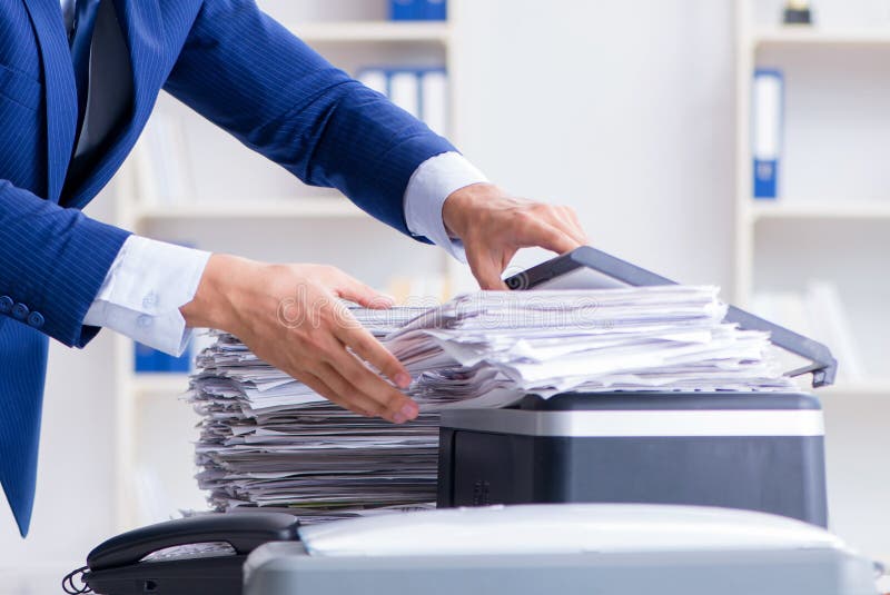 Businessman Making Copies in Copying Machine Stock Photo - Image of ...