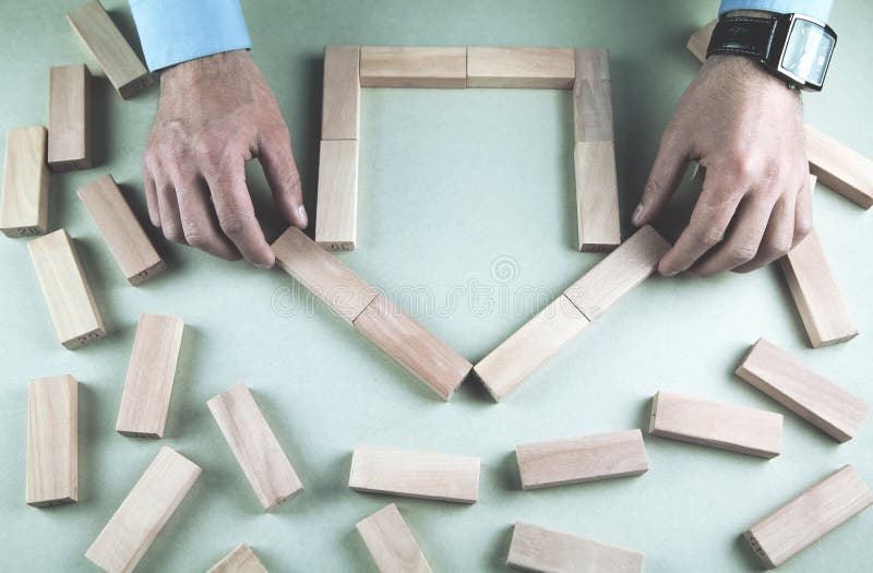 Businessman Making Model House with Wooden Blocks. Stock Image - Image ...