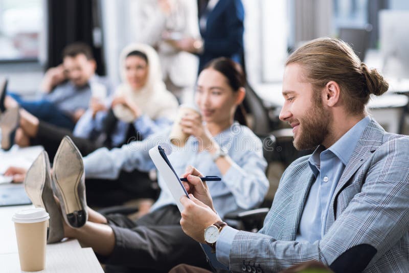 Businessman Making Notes at Workplace Stock Photo - Image of attractive ...