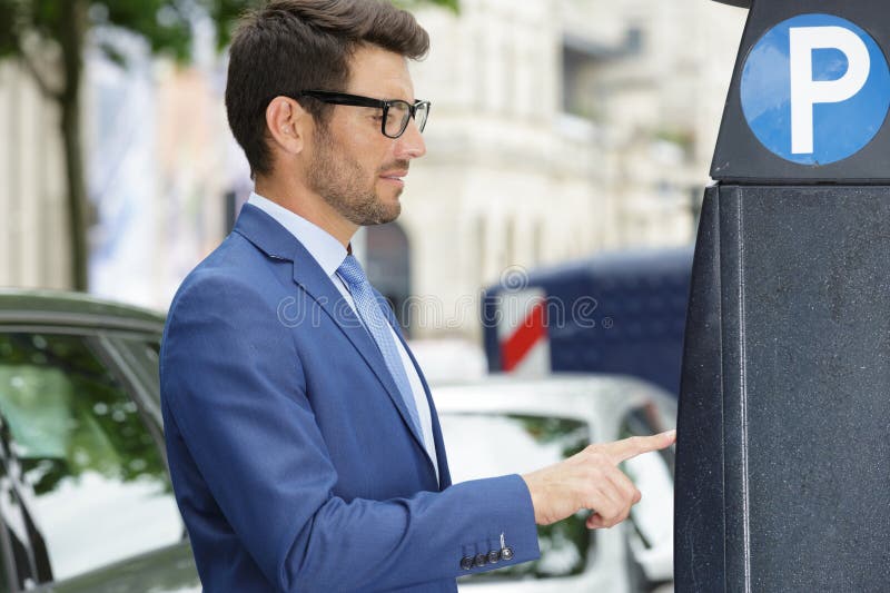 Businessman Making Payment at Parking Meter Stock Photo - Image of ...