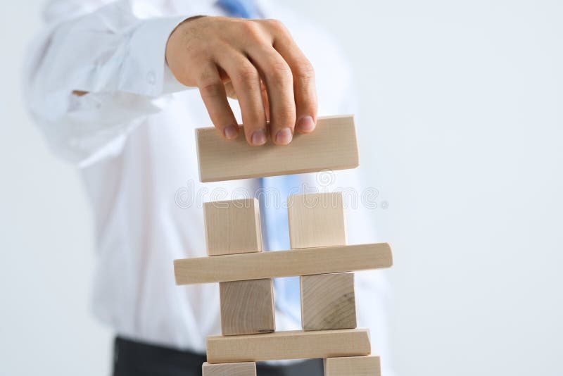 Businessman making tower stock image. Image of housing - 60776225