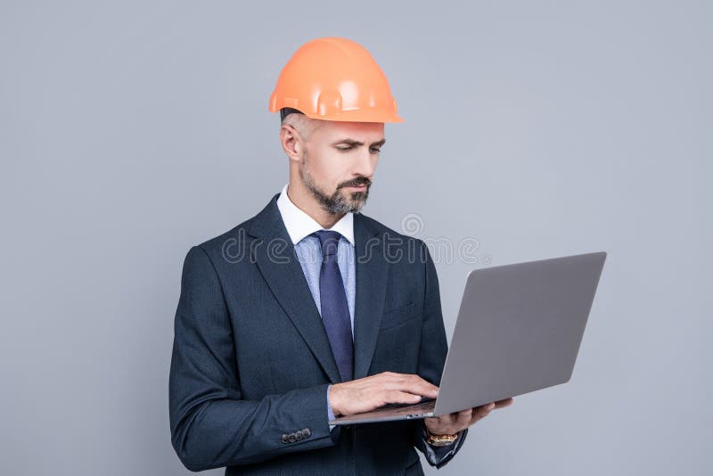 Businessman Man in Building Helmet Using Computer, Safety Online ...