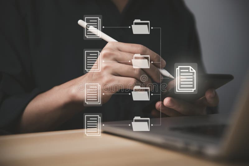 Businessman Managing Electronic Documents on the Laptop. Stock Image ...