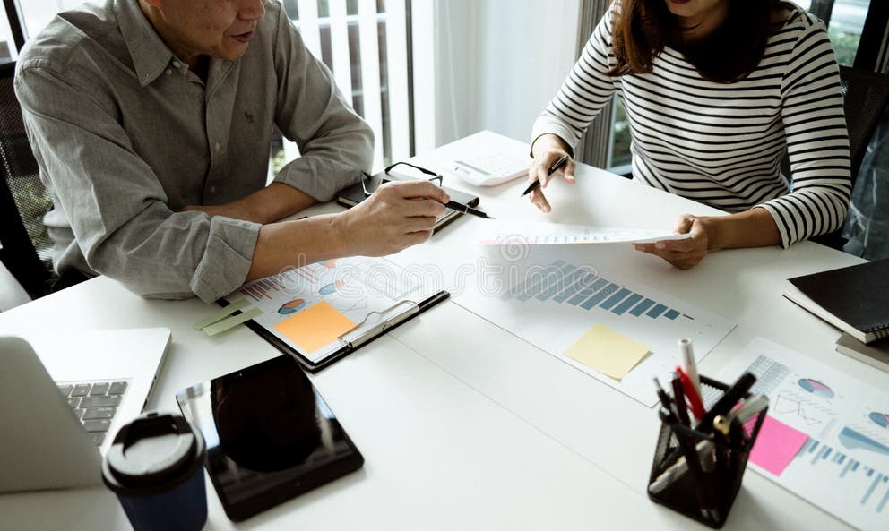 Businessman Meeting in the Office with Graph Introduction Chart To Be ...