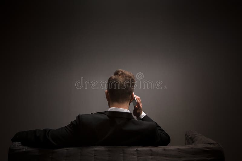 Businessman with mobile stock image. Image of view, sofa - 71550211