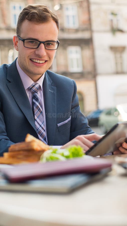 Businessman with Mobile Phone during Breakfast. Stock Image - Image of ...