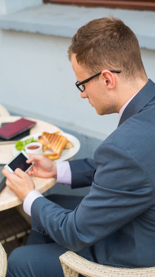 Businessman with Mobile Phone during Breakfast. Stock Photo - Image of ...