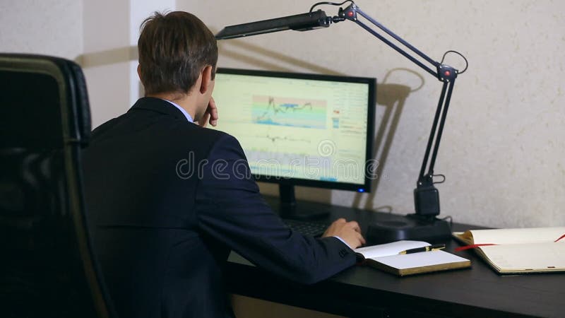 Businessman Monitors Changes in the Schedule on the Currency Exchange ...