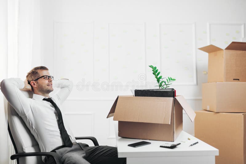 Businessman Moving into a New Office Stock Image - Image of estate ...