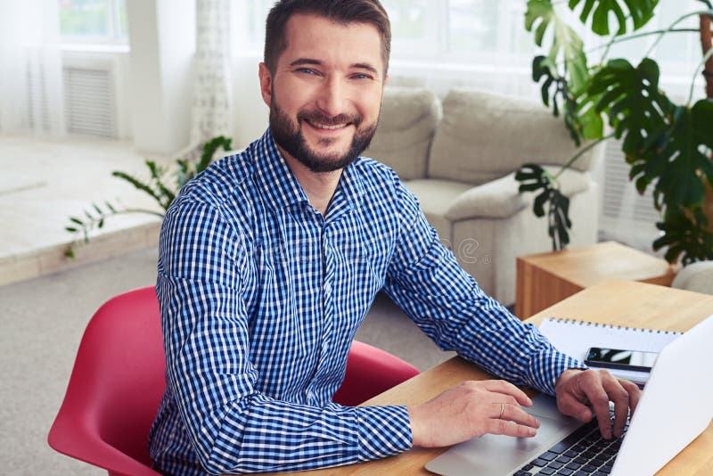 Businessman with Nice Smile Sitting at Table and Working with La Stock ...
