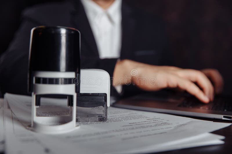 Businessman & X28;or Notary Public& X29; Sitting at the Desk in Office ...