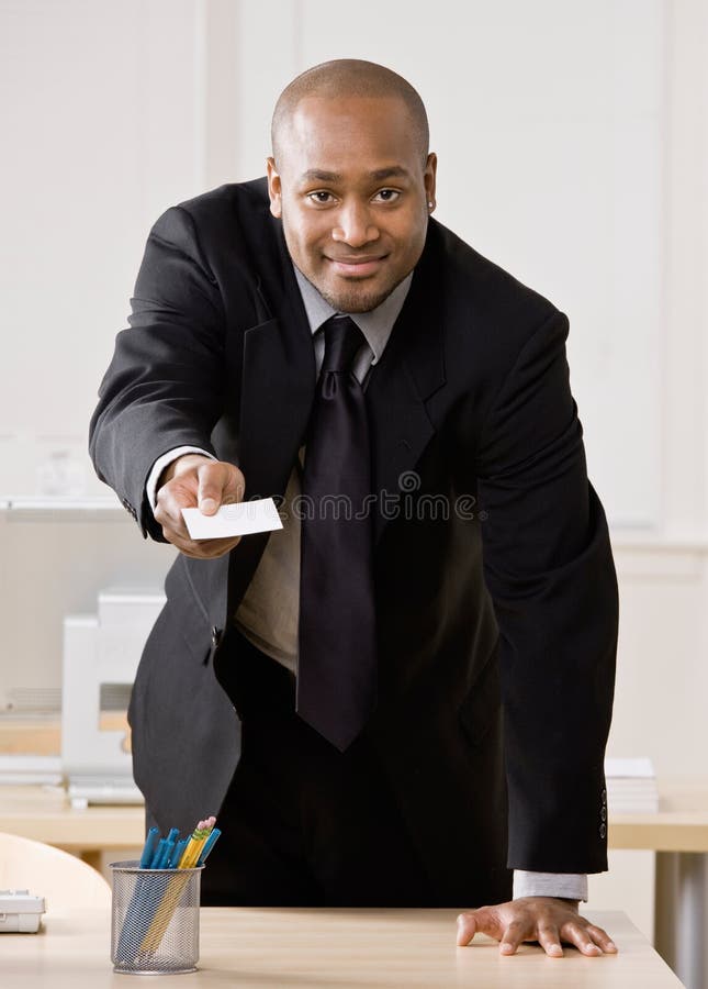 Businessman Offering Business Card To Colleague Stock Photo - Image of ...