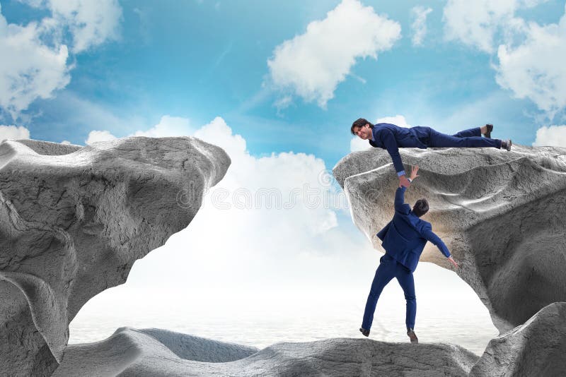 The Businessman Offering Helping Hand To Falling Colleague Stock ...