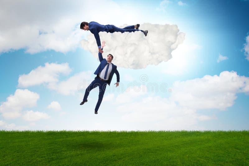 The Businessman Offering Helping Hand To Falling Colleague Stock Photo ...