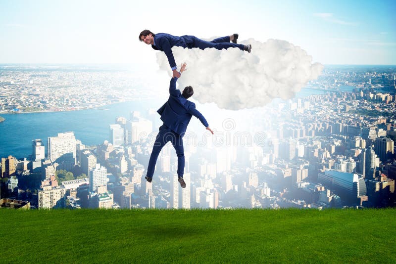 The Businessman Offering Helping Hand To Falling Colleague Stock Photo ...