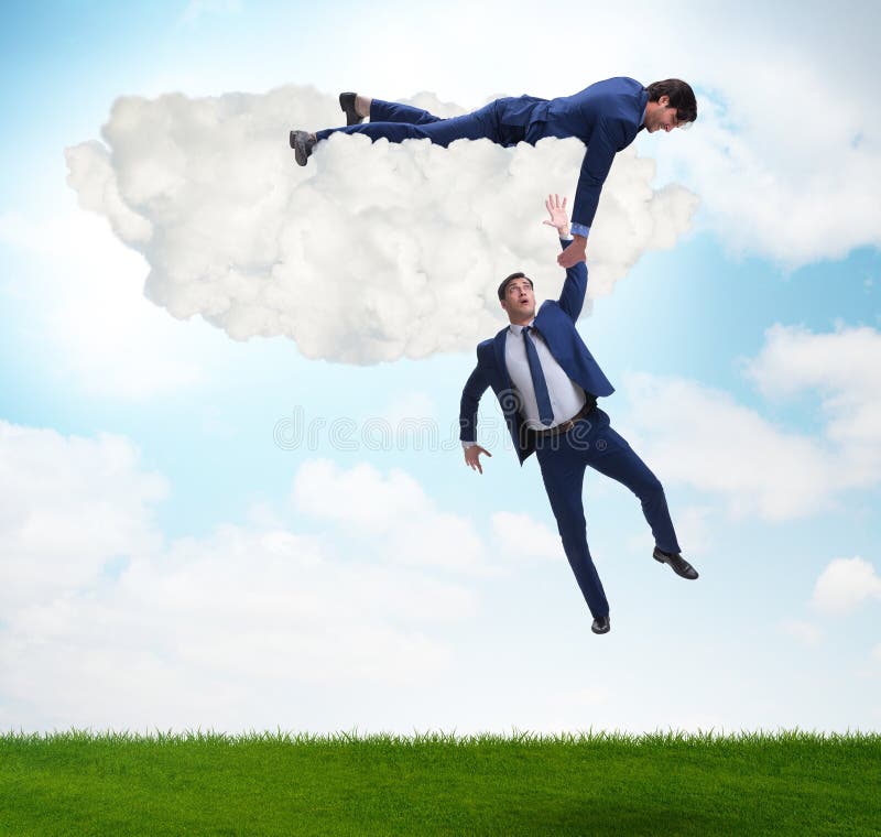 Businessman Offering Helping Hand To Falling Colleague Stock Photo ...