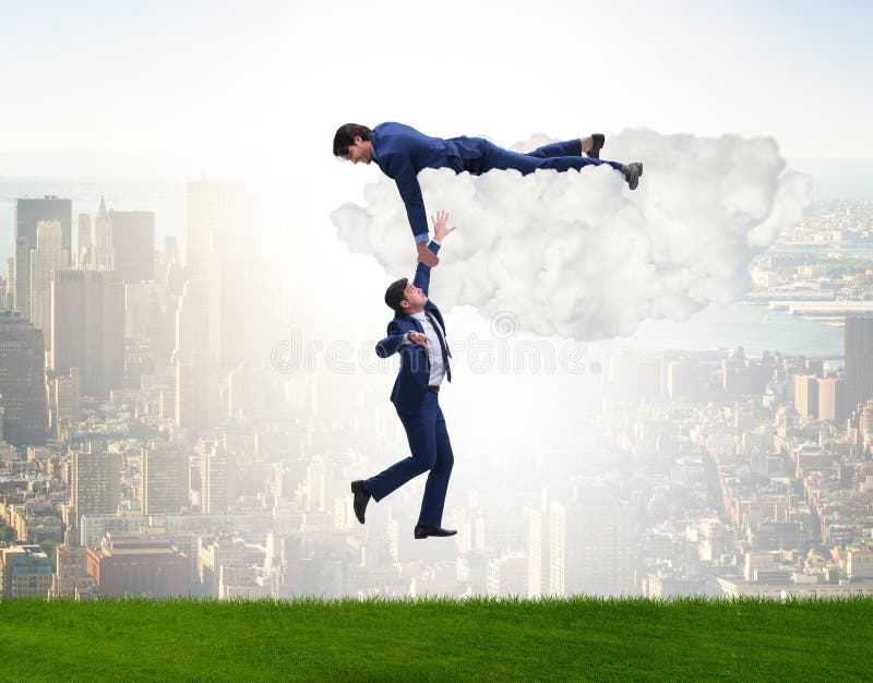 Businessman Offering Helping Hand To Falling Colleague Stock Photo ...