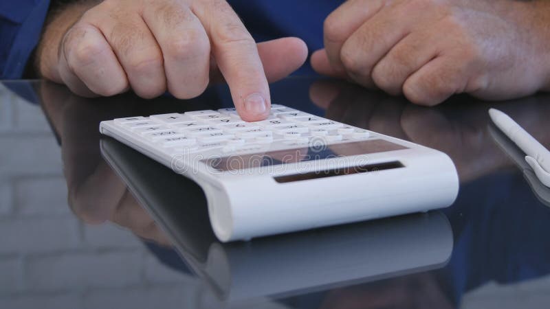 Businessman in Office Calculating Using Adding Machine Stock Image ...