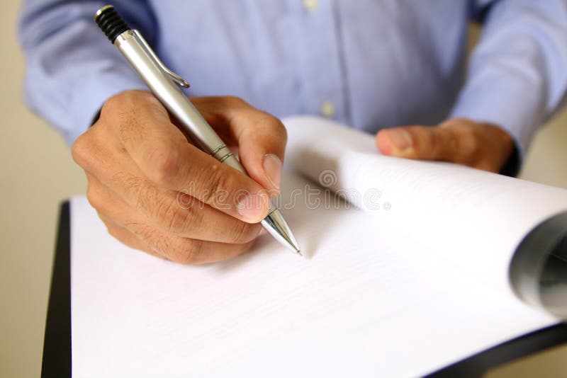 Businessman at Office Desk Signing a Contract Stock Photo - Image of ...