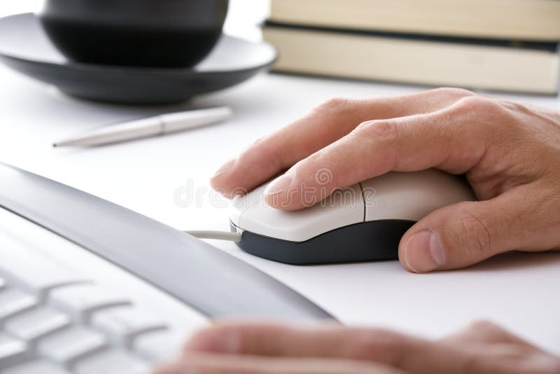 Businessman in Office with Hand on Computer Mouse Stock Photo - Image ...