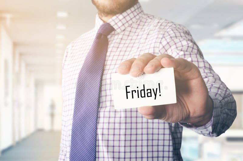 Businessman in Office Showing Card with Text: Friday Stock Photo ...