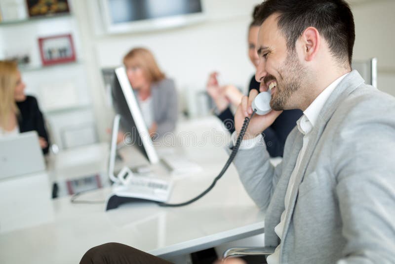 Phonecall at meeting stock image. Image of businessman - 15232585