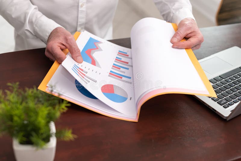 Businessman opening folder stock image. Image of businessman - 240436545