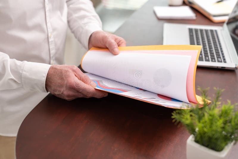 Businessman opening folder stock image. Image of report - 260598517