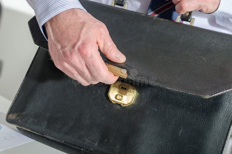 Businessman Opening His Briefcase Stock Photo - Image of holding ...