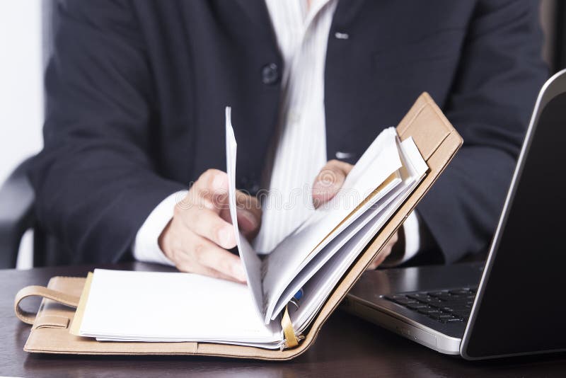 Businessman Opening His Notebook Stock Image - Image of confident ...