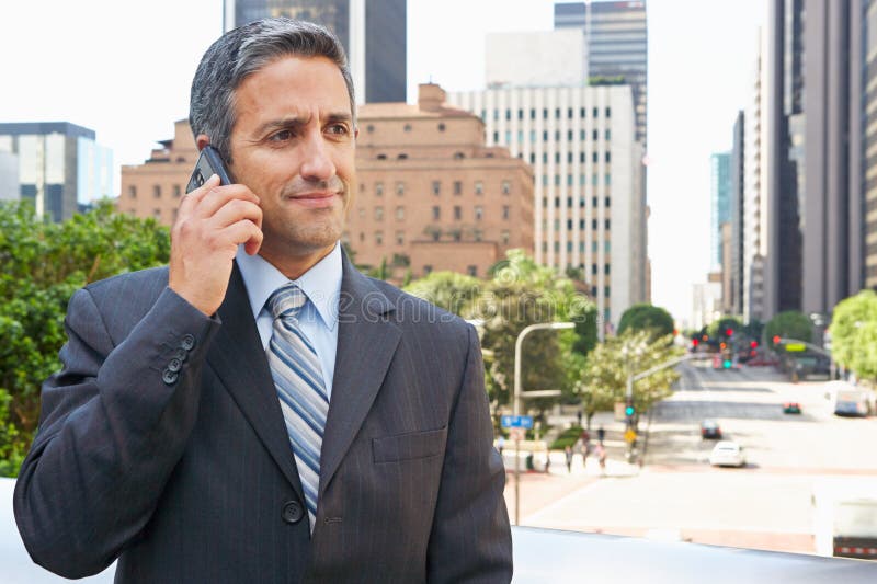 Businessman Outside Office on Mobile Phone Stock Image - Image of ...