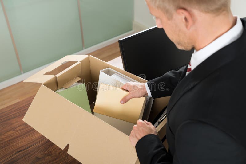 Businessman Packing Files in Cardboard Box Stock Image - Image of ...