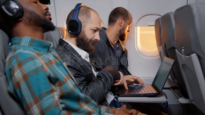 Businessman Passenger Using Laptop Computer on Flight Stock Photo ...