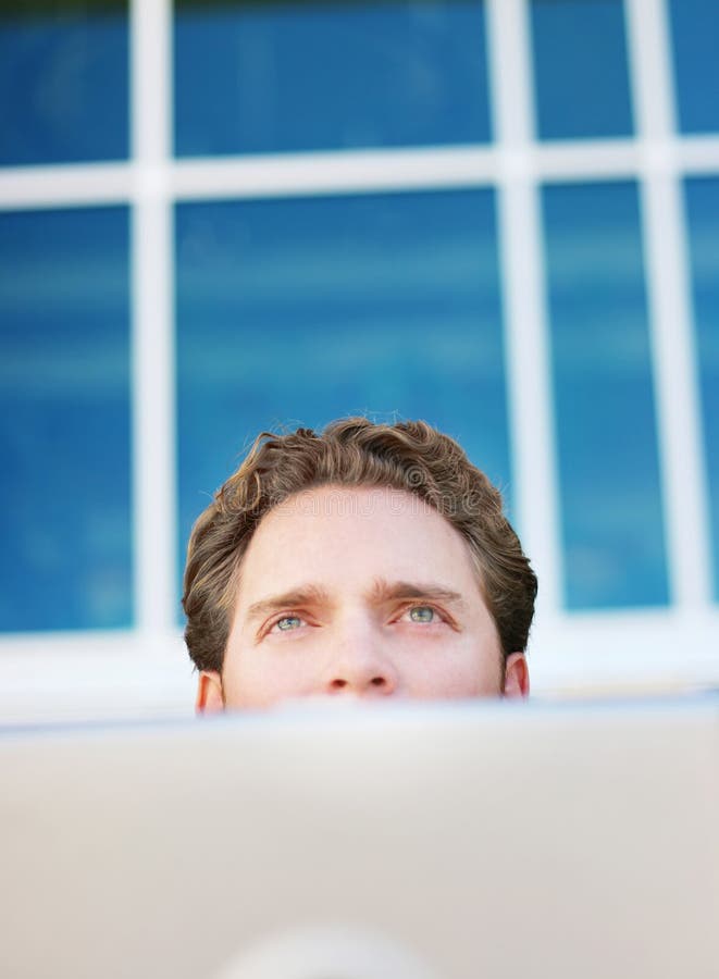 Businessman Peering Over Laptop Stock Photo - Image of corporate ...