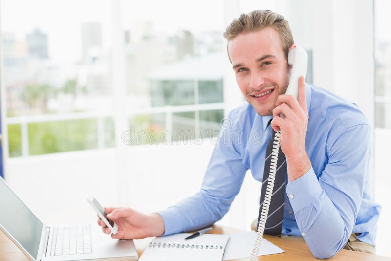 Businessman on the Phone while Text Messaging Stock Photo - Image of ...