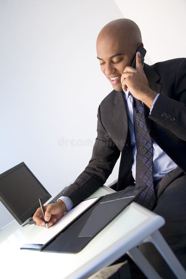 Businessman On Phone Writing Stock Photo - Image of classy, cell: 5645462