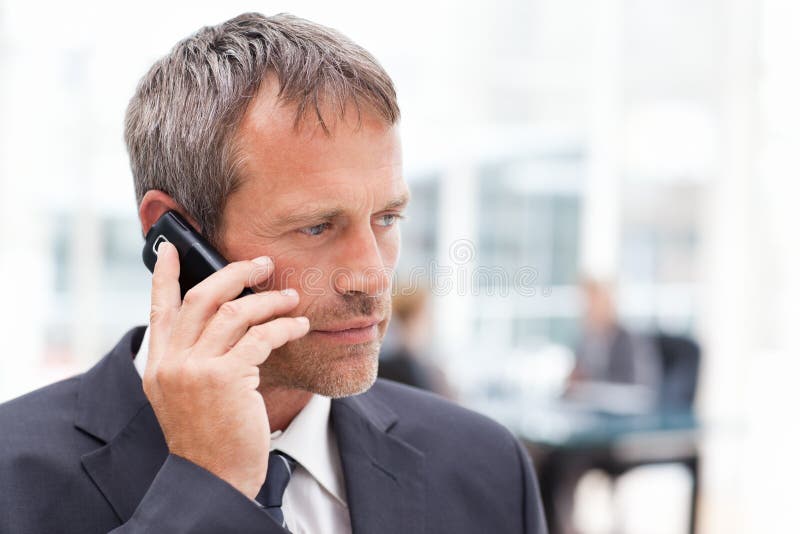 Businessman Phoning in His Office Stock Photo - Image of foreground ...
