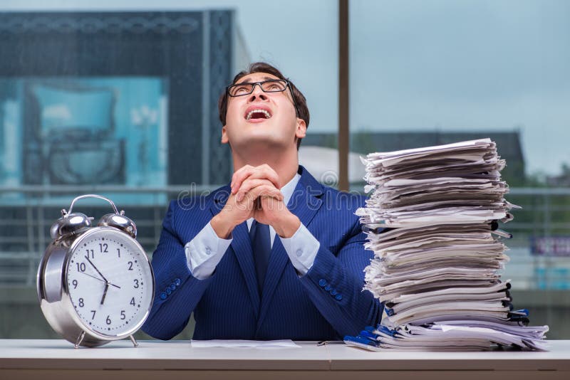 Businessman with Pile Stack of Paper Paperwork and an Alarm Cloc Stock ...