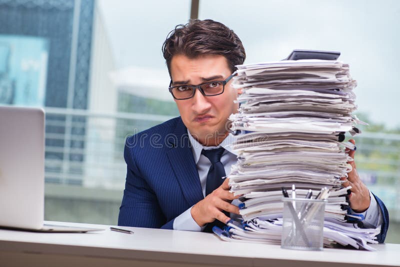 The Businessman with Pile Stack of Paper Paperwork in the Office Stock ...