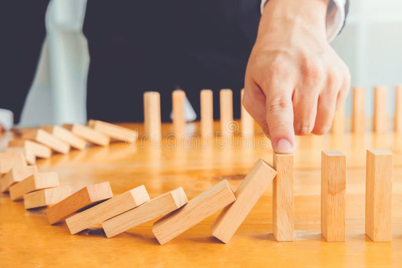 Businessman Plan and Strategy in Business Domino Effect Problem Stock ...