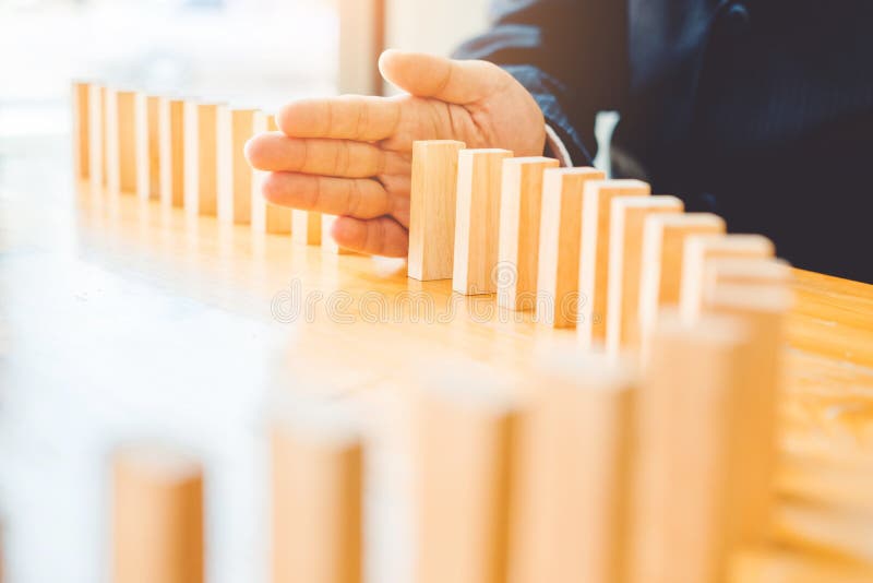 Businessman Plan and Strategy in Business Domino Effect Problem Stock ...