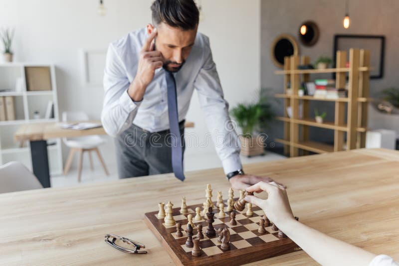 Businessman Playing Chess with Colleague in Office Stock Image - Image ...