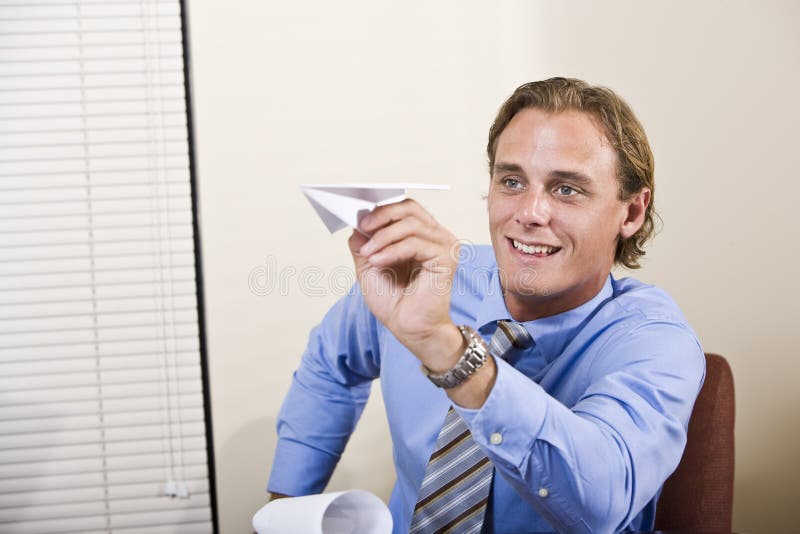 Businessman Playing with Paper Airplane Stock Image - Image of person ...
