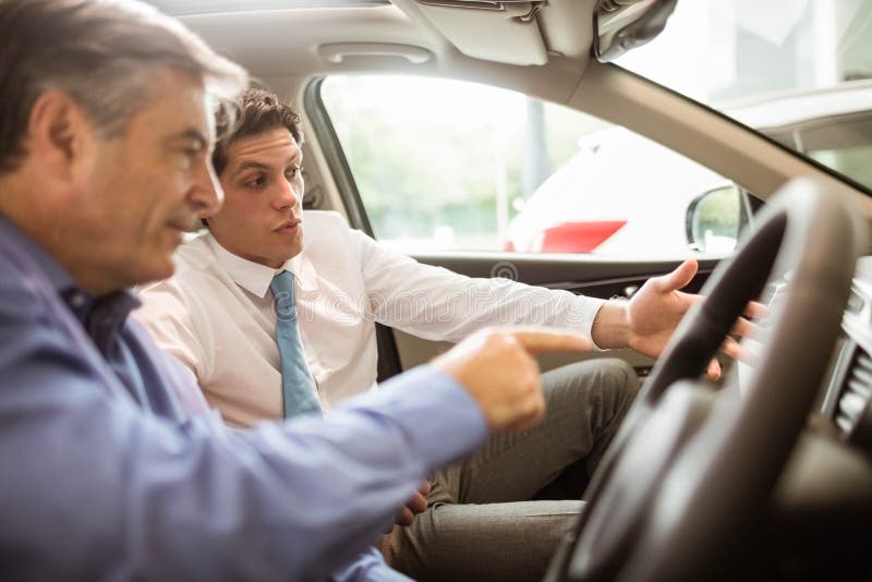 Businessman Pointing a Car Interior Stock Image - Image of people ...