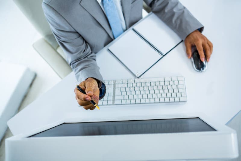 Businessman Pointing at Computer Monitor Stock Image - Image of elegant ...