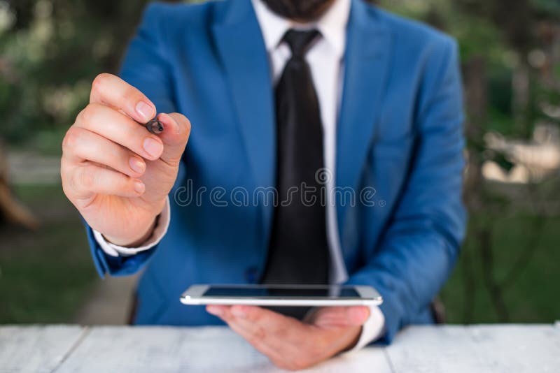 Businessman Pointing with Pen in Empty Copy Space. Business Concept ...