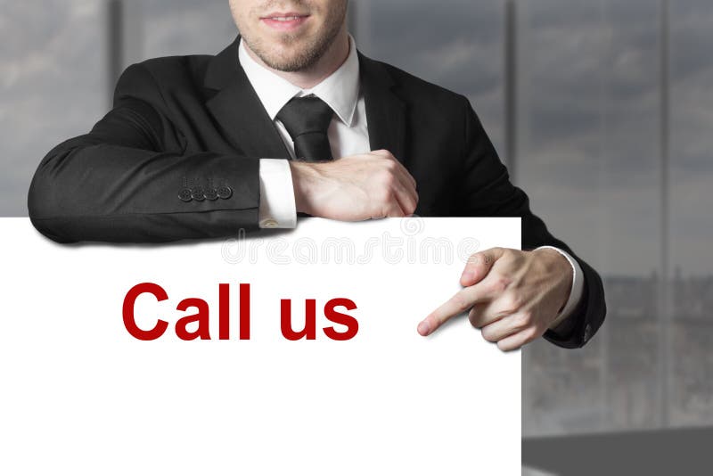 Businessman Pointing on Sign Call Us Stock Photo - Image of enterprise ...