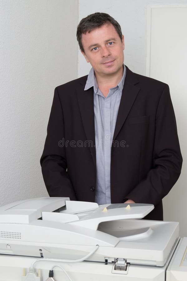 Businessman Portrait at Copy Machine Stock Image - Image of portrait ...