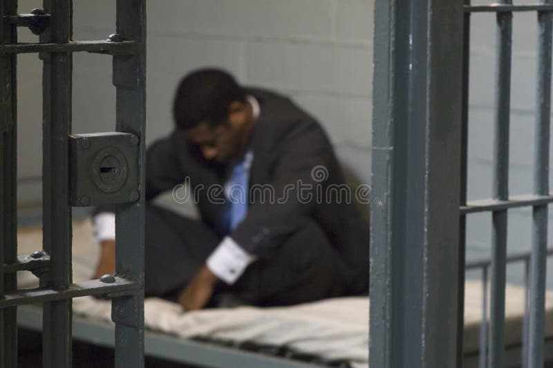 Man Sitting on Bed in Prison Cell Stock Photo - Image of adult, anxiety ...