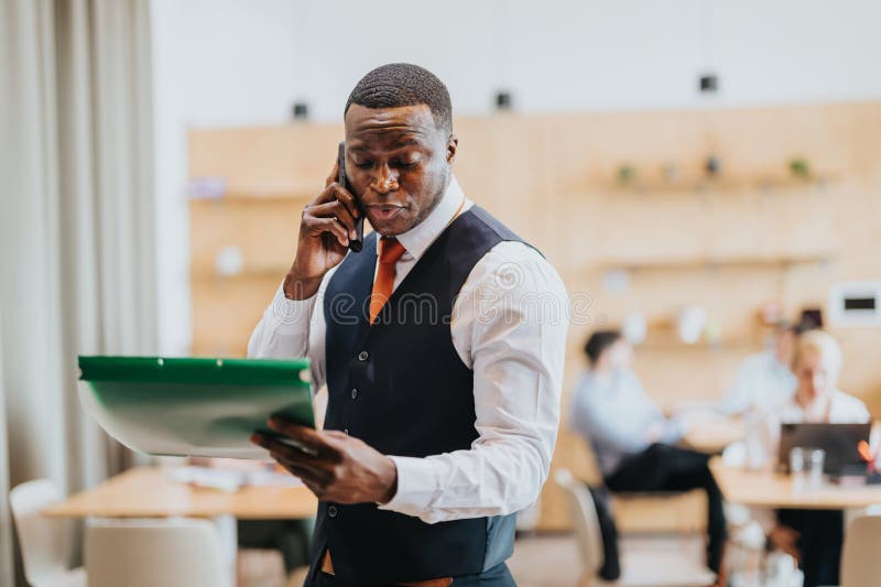 Professional Man Multitasking in a Collaborative Co Working Space Stock ...